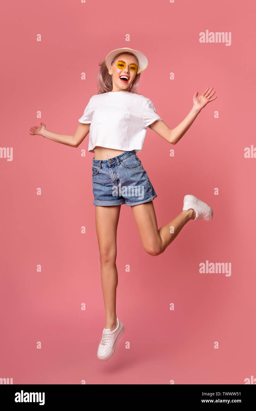 Fashion Girl Jumping on Pink Background, Summer Teen Style Stock Photo ...