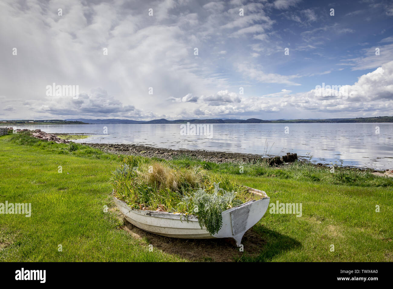 Rowing boat on the shores of the Moray Firth, Ardersier, Highlands ...