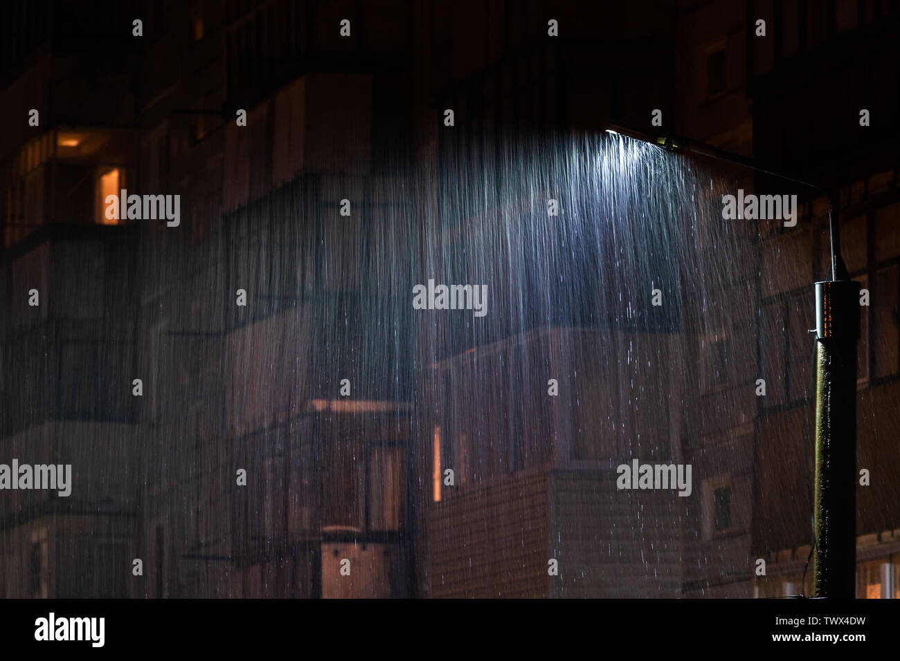 lamp post at rainy nigh with selective focus and long exposure motion ...