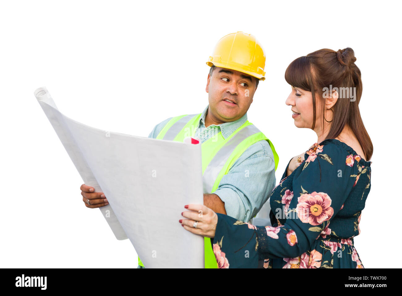 Hispanic Male Contractor Talking with Female Client Over Blueprint ...