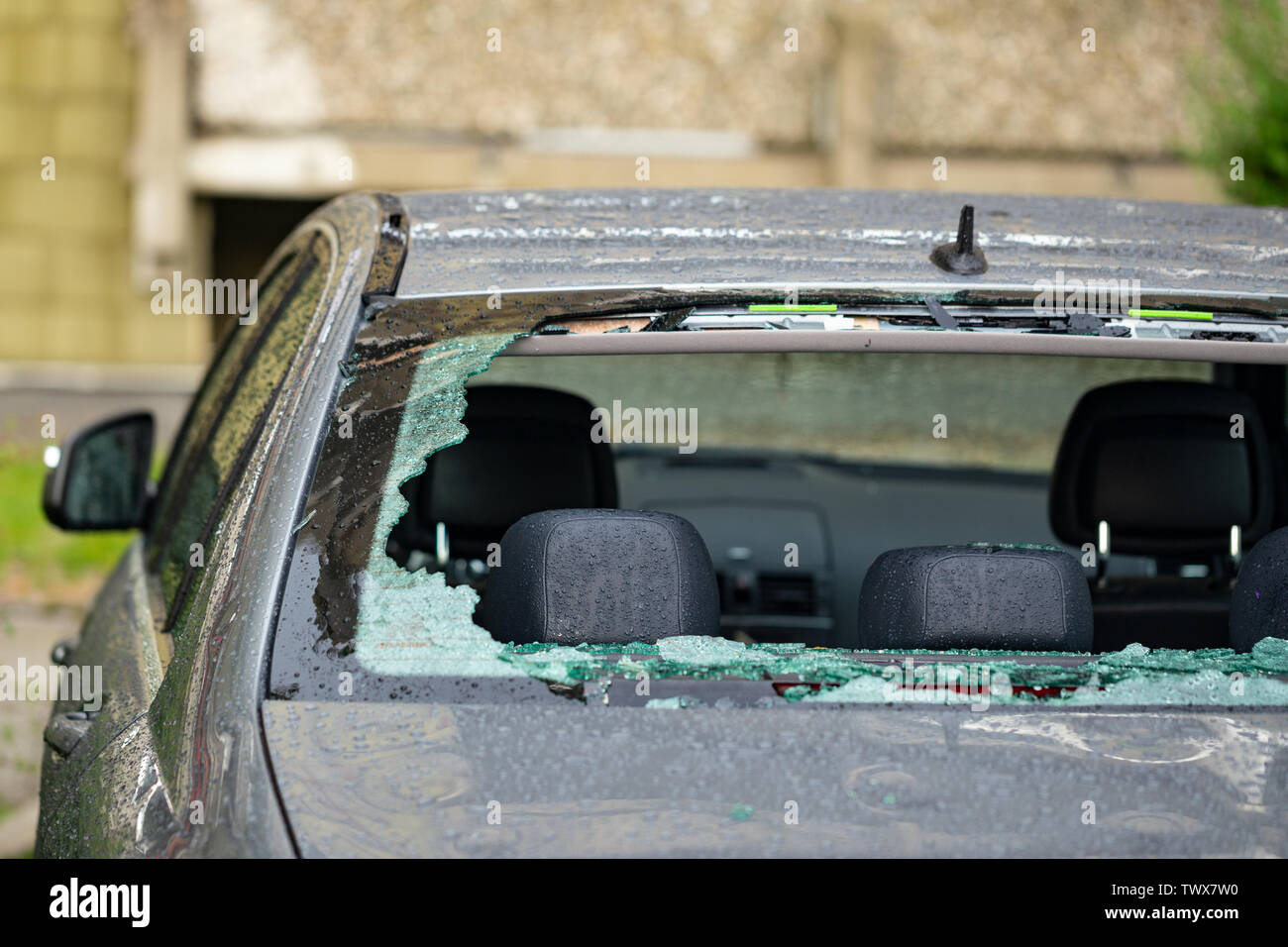 Hail damage to rear window after a severe thunderstorm Stock Photo - Alamy