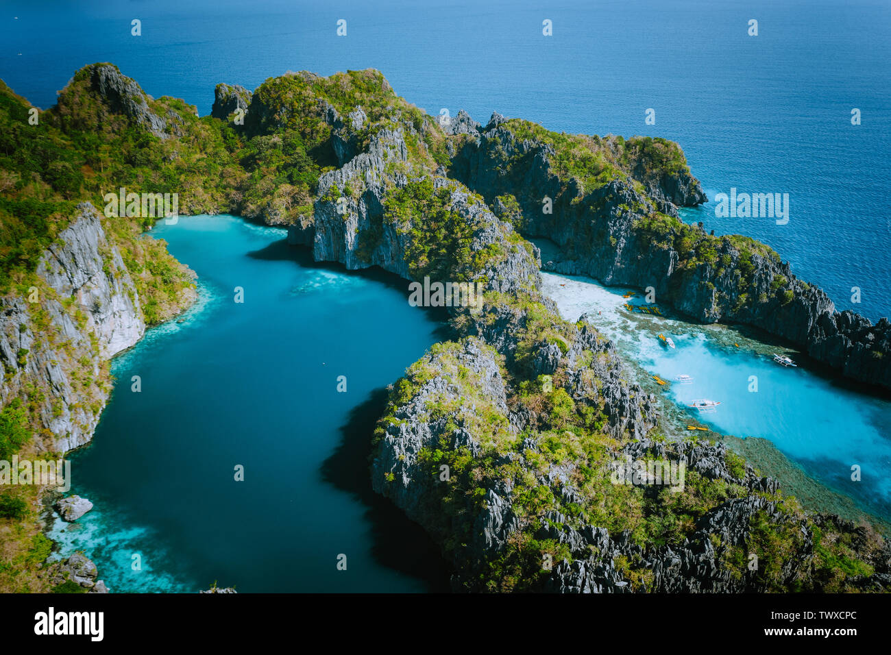 Aerial drone view of Big lagoon surrounded by jagged limestone karst ...