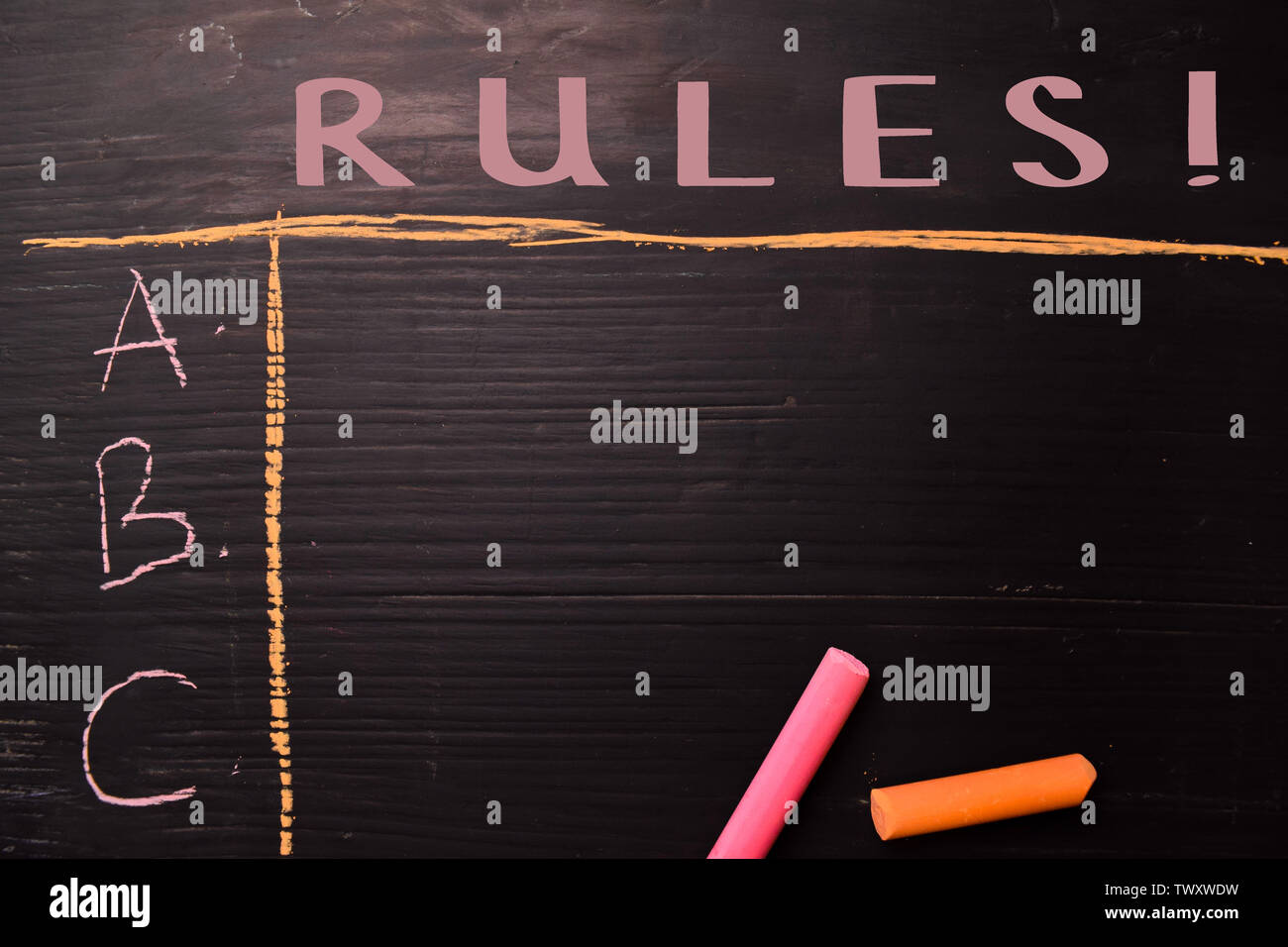 Rules! written with color chalk. Supported by an additional services ...