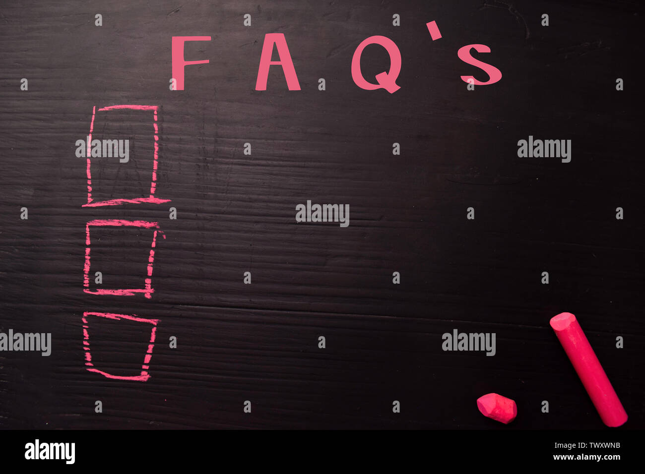 FAQ's written with color chalk. Supported by an additional services ...