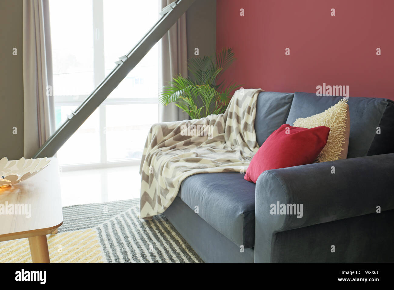 Big soft sofa in interior of living room Stock Photo - Alamy
