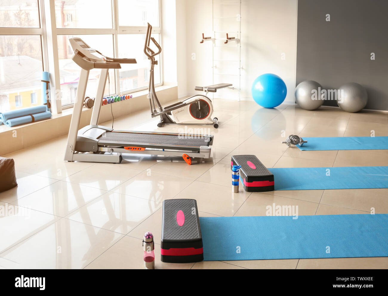 Interior of gym with modern equipment Stock Photo - Alamy