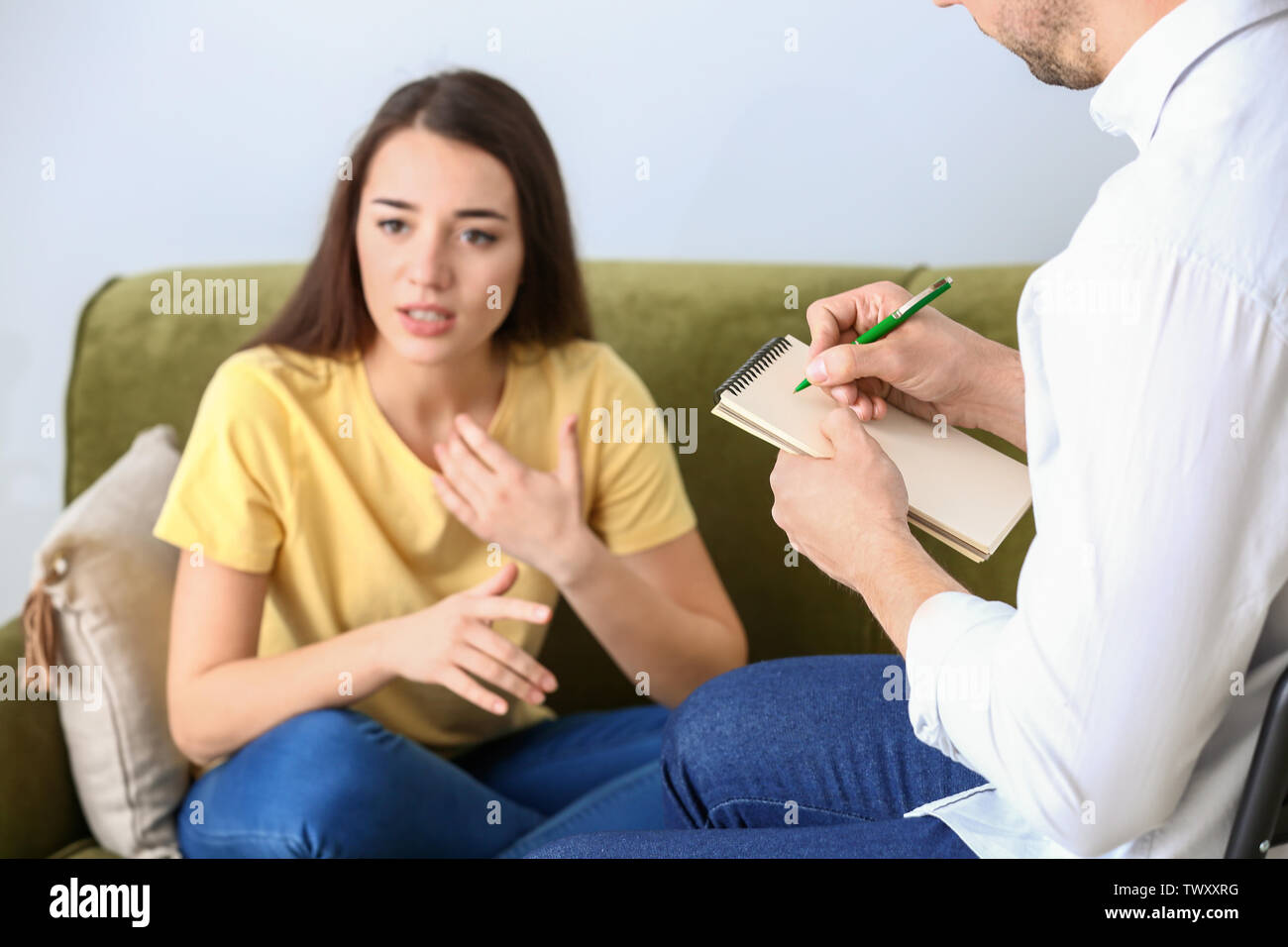 Psychologist working with woman in office Stock Photo - Alamy
