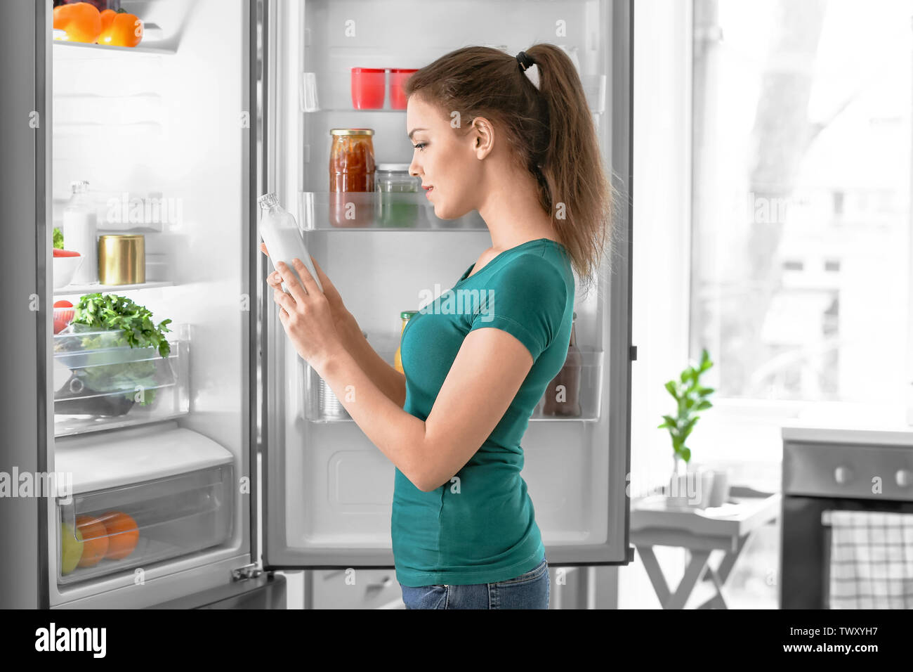 Taking milk out of the fridge hi-res stock photography and images - Alamy