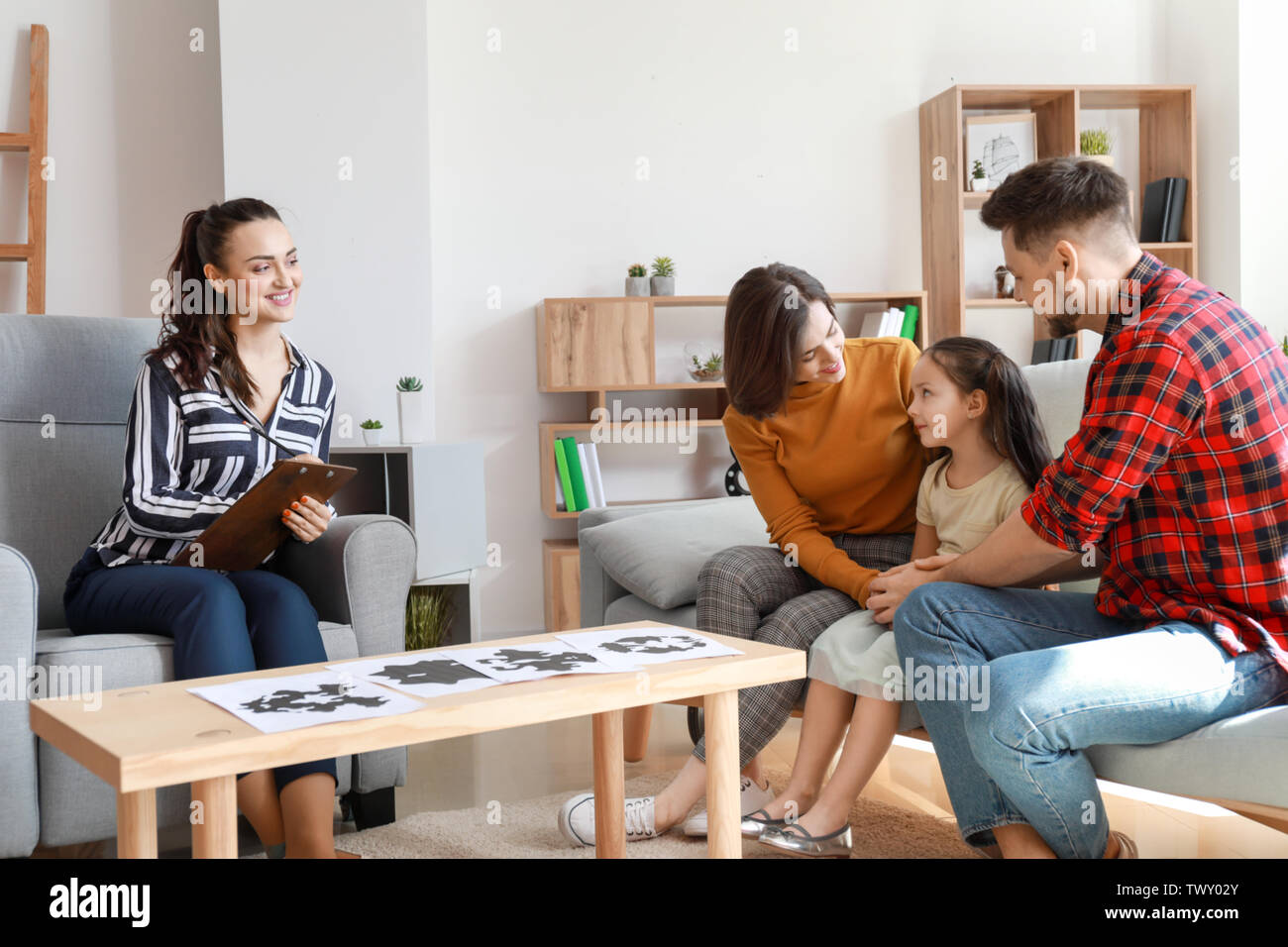 Family visiting psychologist in office Stock Photo - Alamy