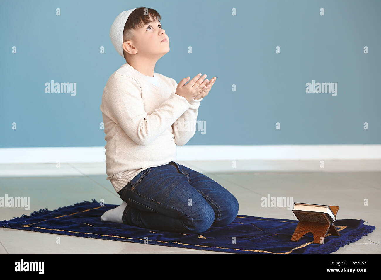 Little Muslim boy praying indoors Stock Photo - Alamy