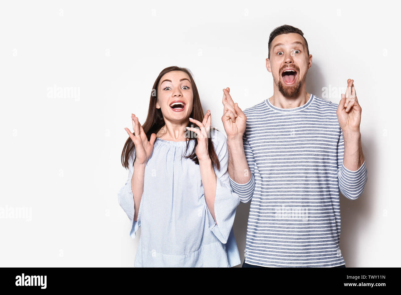 Couple and crossed fingers hi-res stock photography and images - Alamy