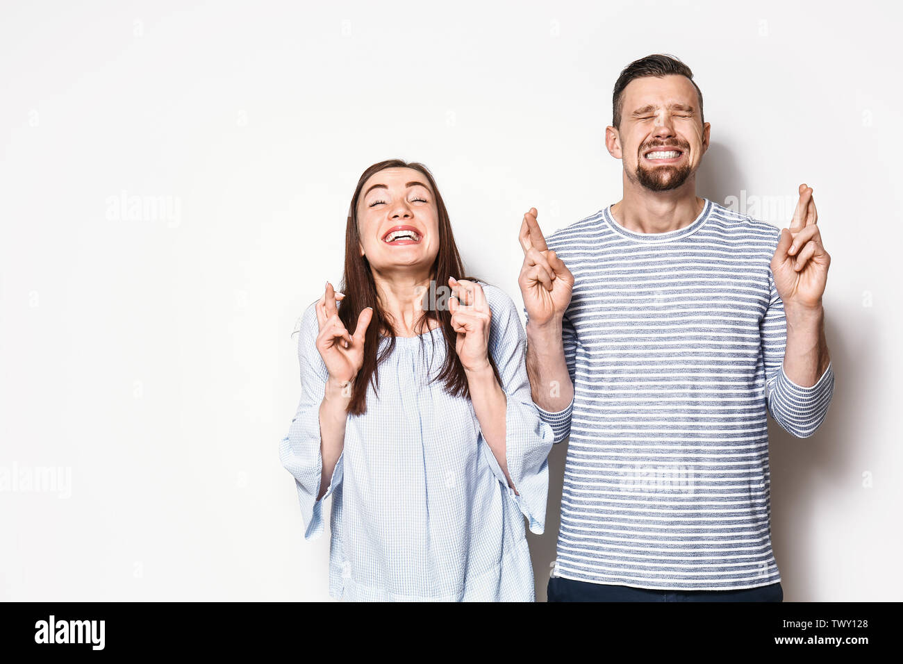 Fingers crossed and couple hi-res stock photography and images - Alamy