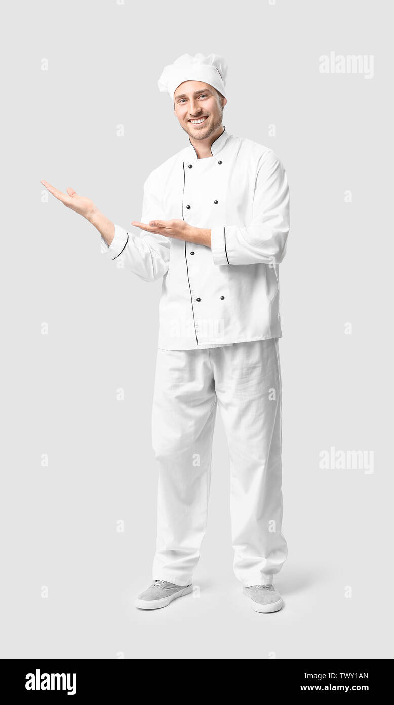Handsome male chef on white background Stock Photo - Alamy