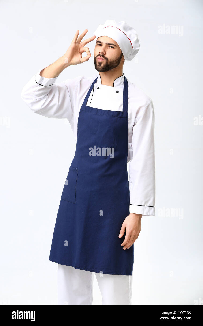 Handsome male chef on white background Stock Photo - Alamy