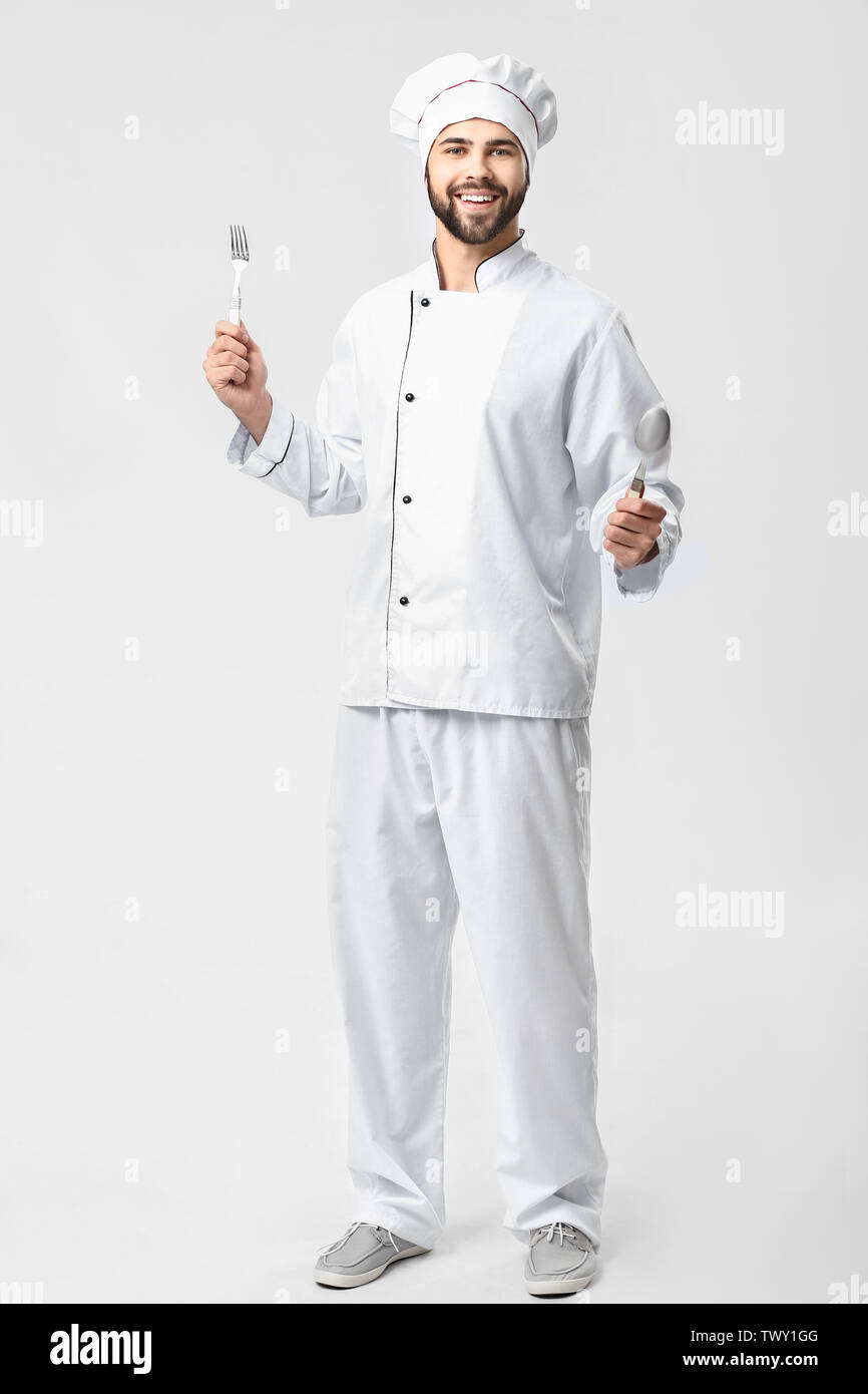 Handsome male chef on white background Stock Photo - Alamy
