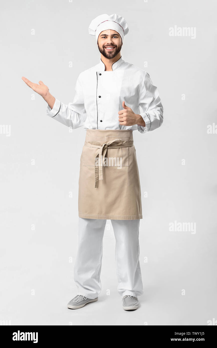 Handsome male chef on white background Stock Photo - Alamy