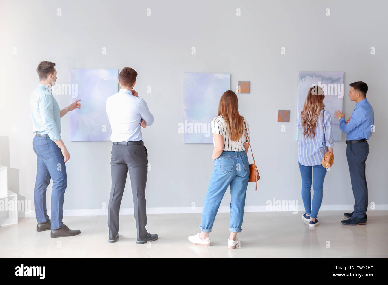 People at exhibition in modern art gallery Stock Photo - Alamy