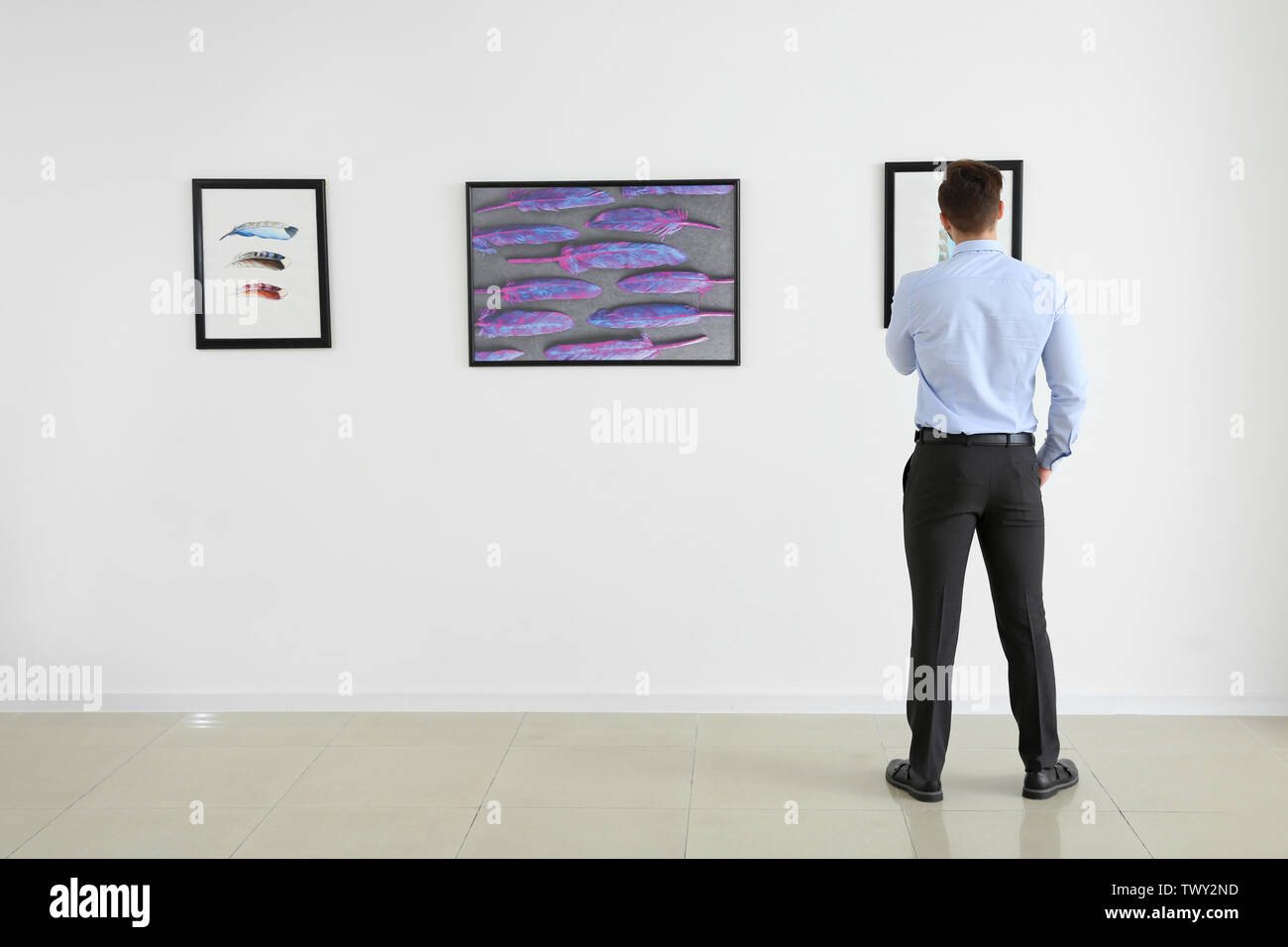 Man at exhibition in modern art gallery Stock Photo - Alamy