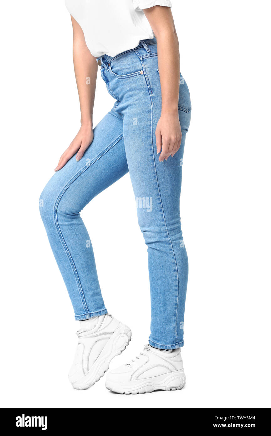 Beautiful young woman in jeans on white background Stock Photo - Alamy