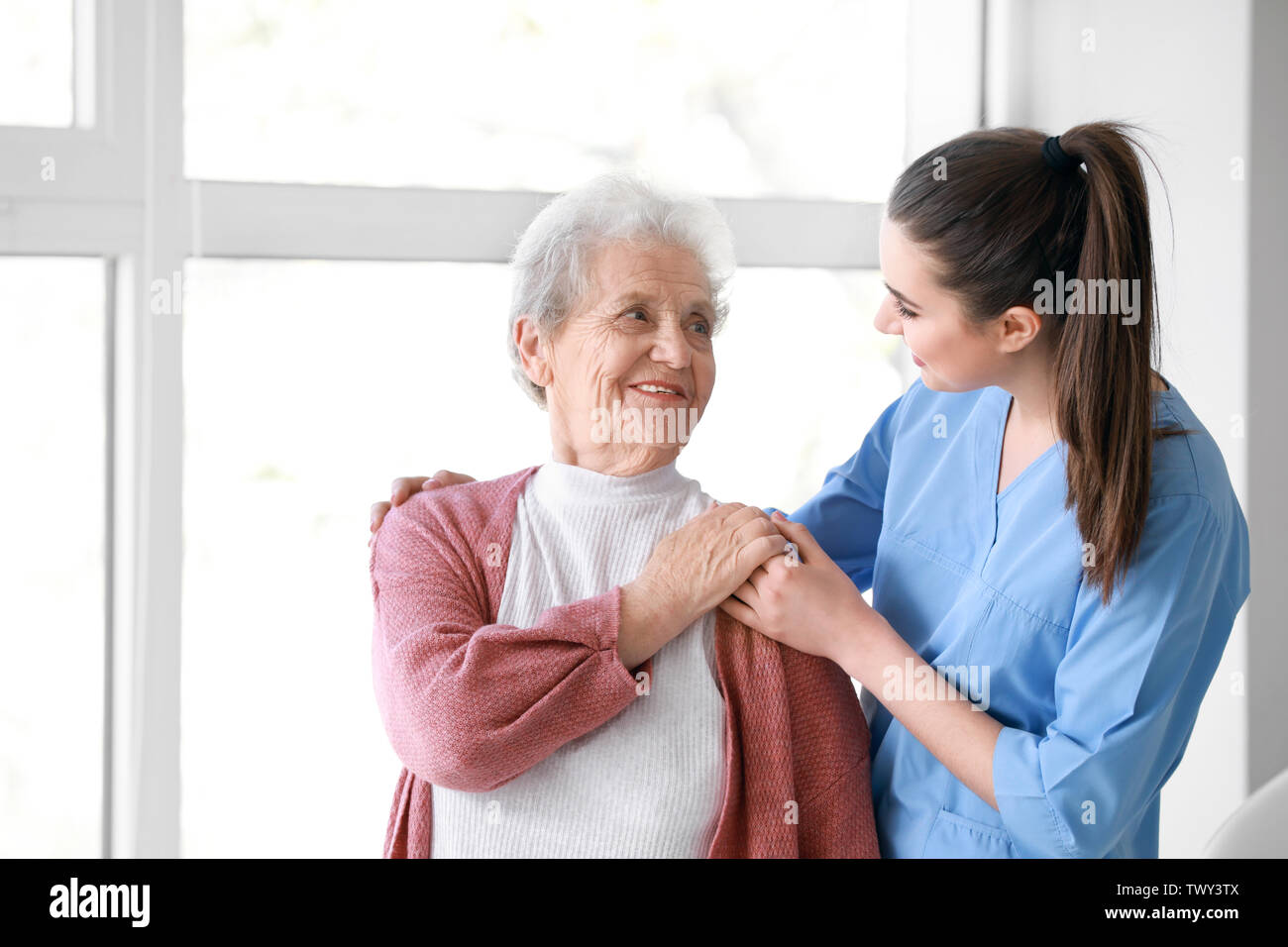 Medical worker with senior woman in nursing home Stock Photo - Alamy