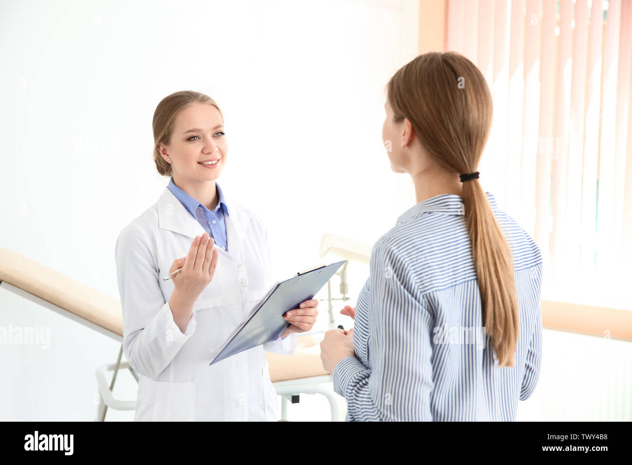 Female gynecologist working with patient in clinic Stock Photo - Alamy