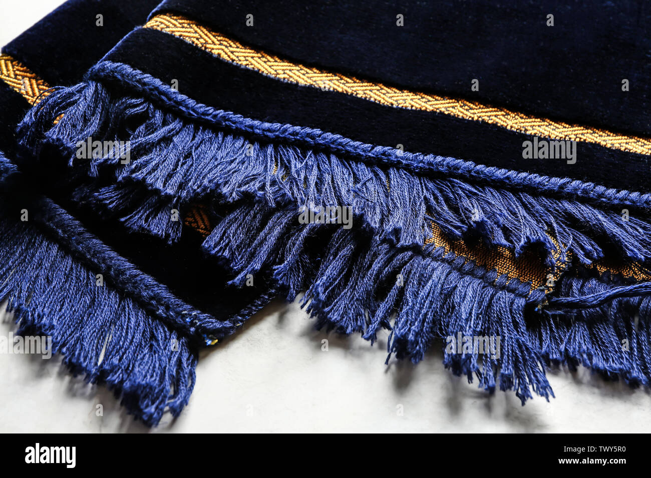 Muslim prayer mat on light background Stock Photo - Alamy