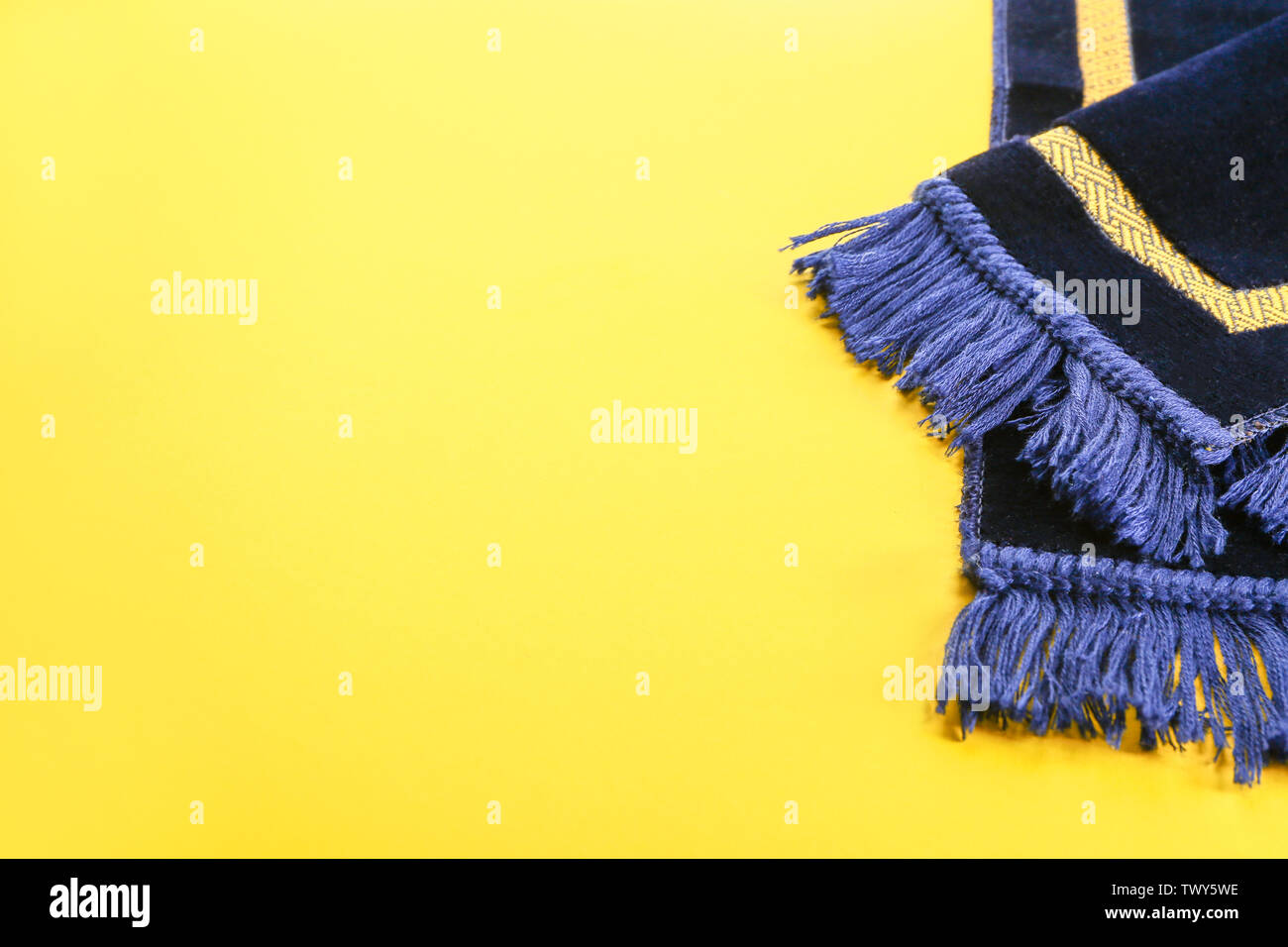 Muslim prayer mat on color background Stock Photo - Alamy