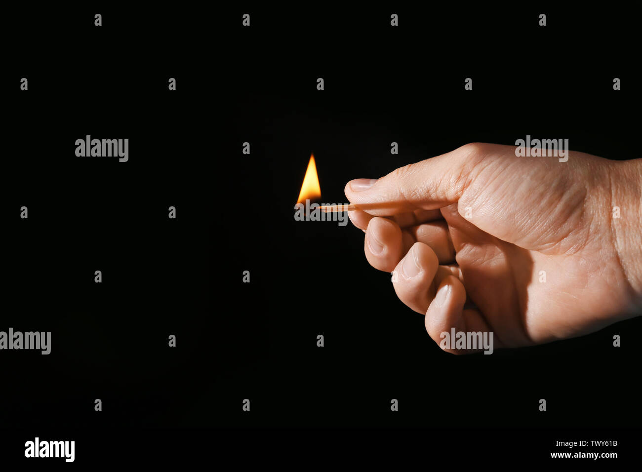 Person holding burning match hi-res stock photography and images - Alamy