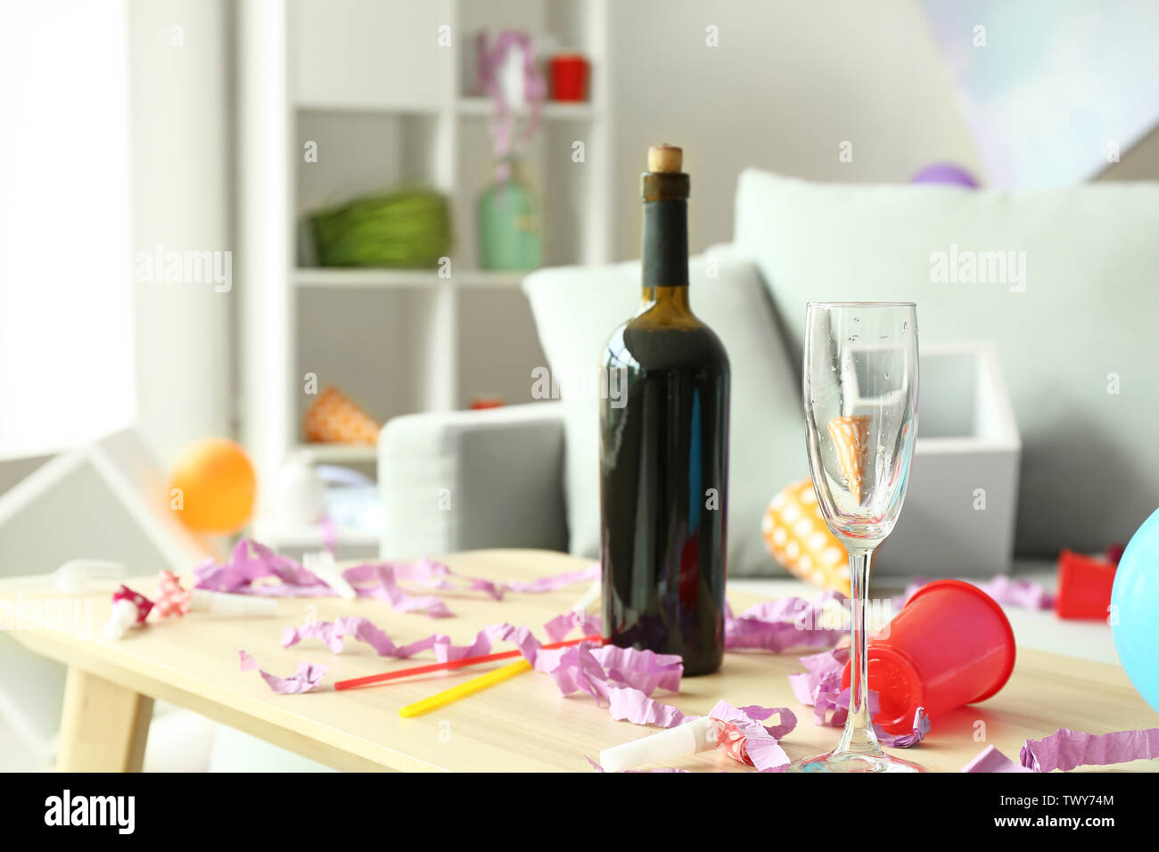 Table with trash in room after party Stock Photo - Alamy