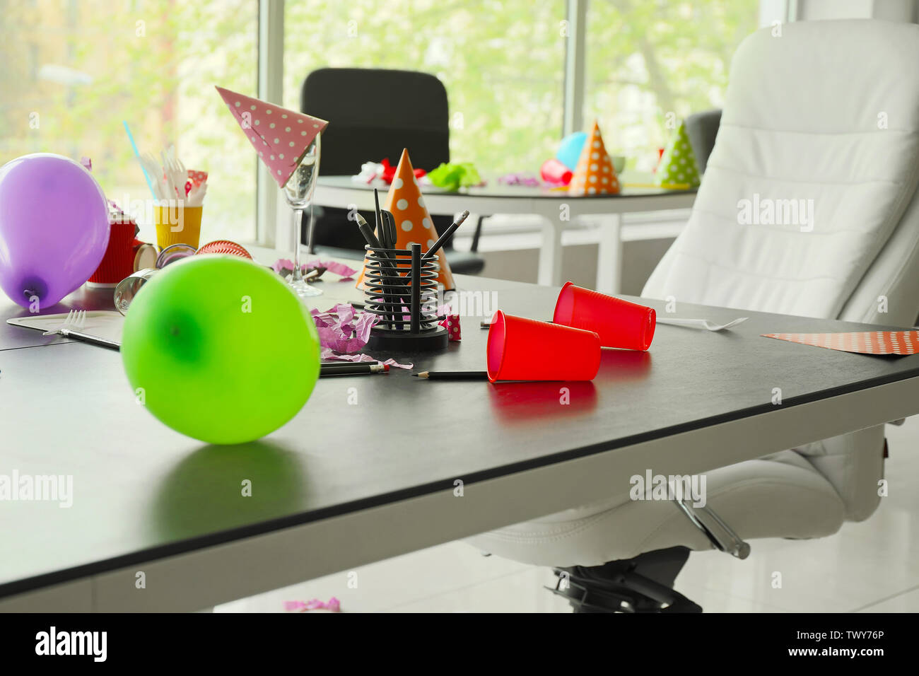 Table with trash in office after party Stock Photo - Alamy