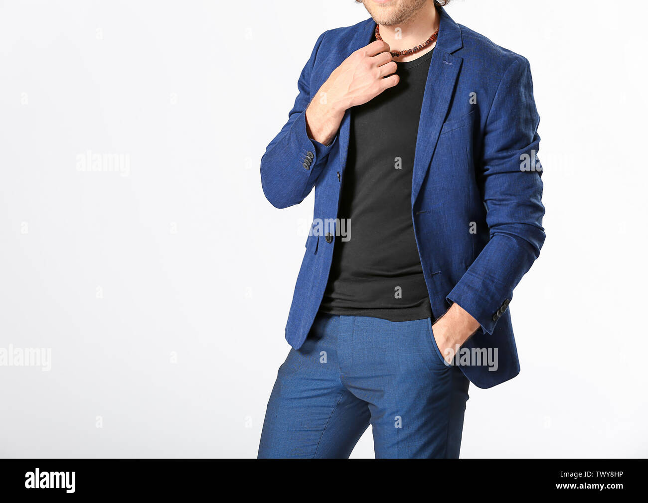 Stylish young man in formal clothes on white background Stock Photo - Alamy