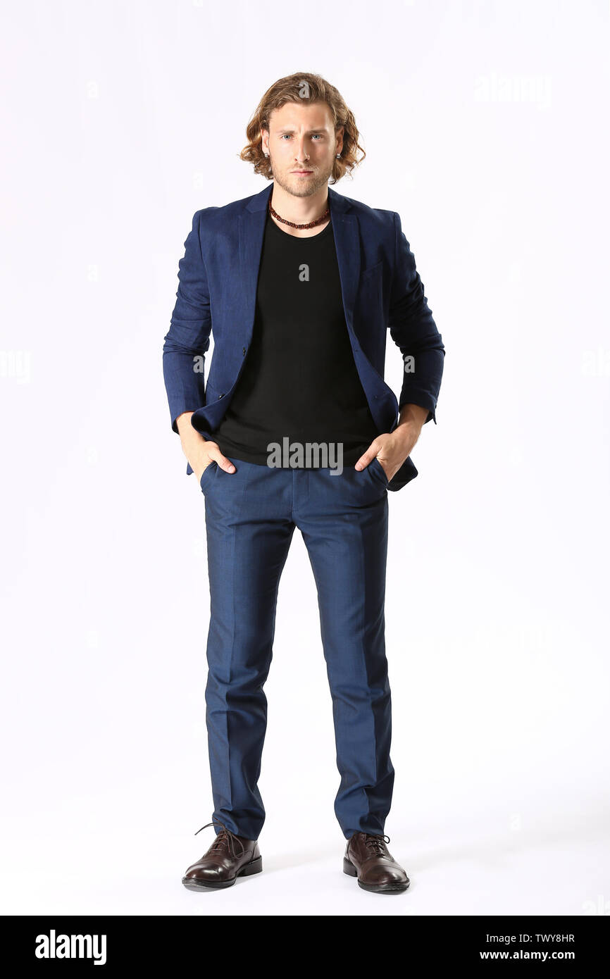Stylish young man in formal clothes on white background Stock Photo - Alamy