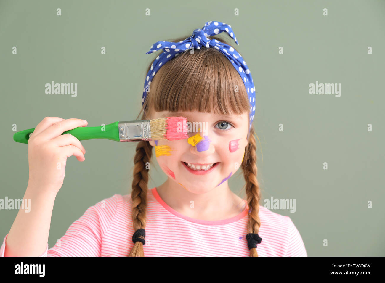 Cute little artist on color background Stock Photo - Alamy