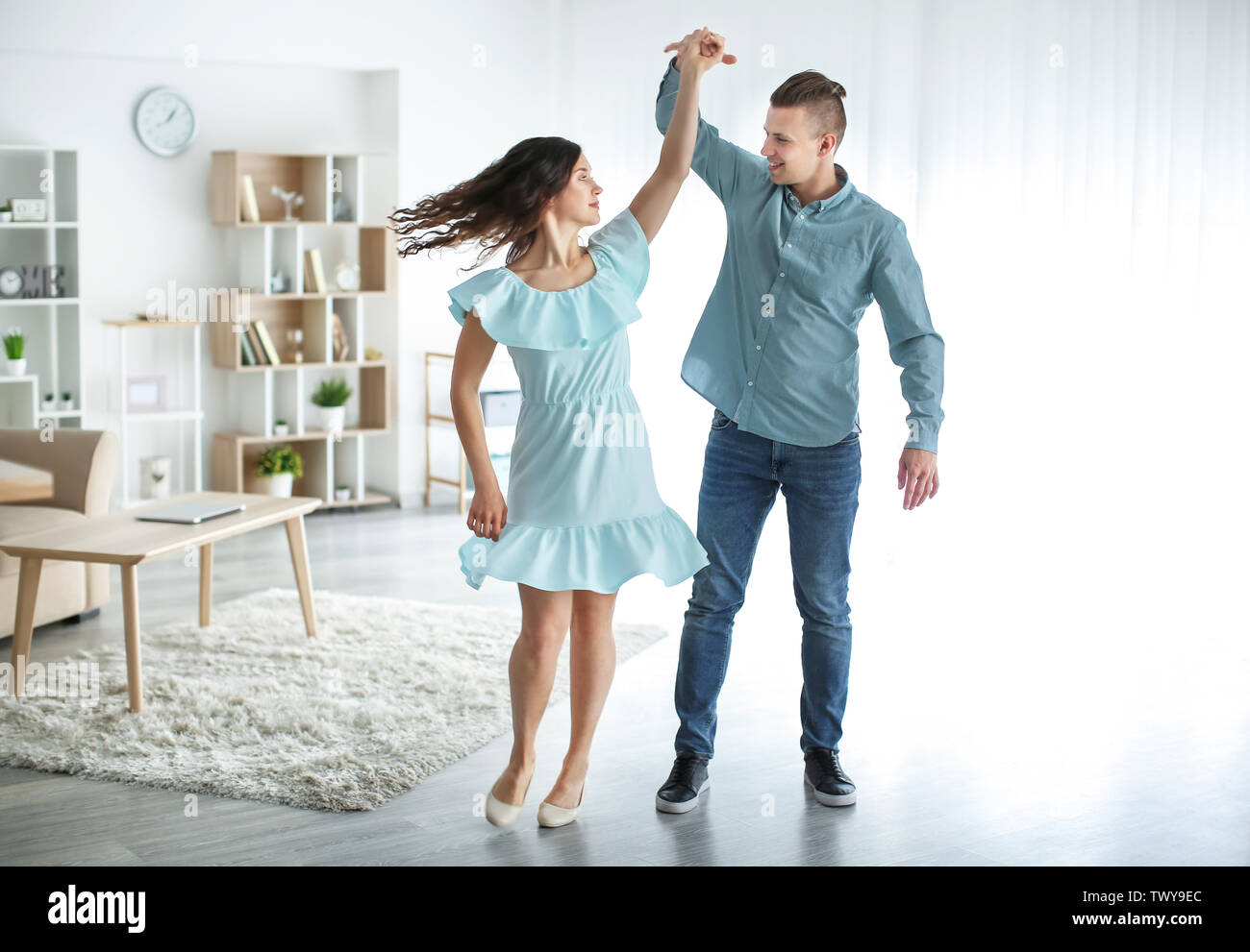 Adorable loving couple dancing at home Stock Photo - Alamy