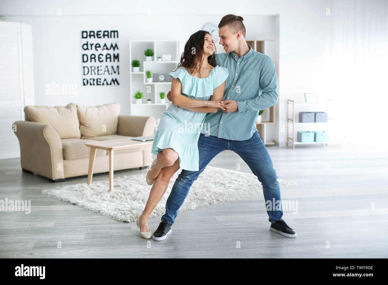 Adorable loving couple dancing at home Stock Photo - Alamy