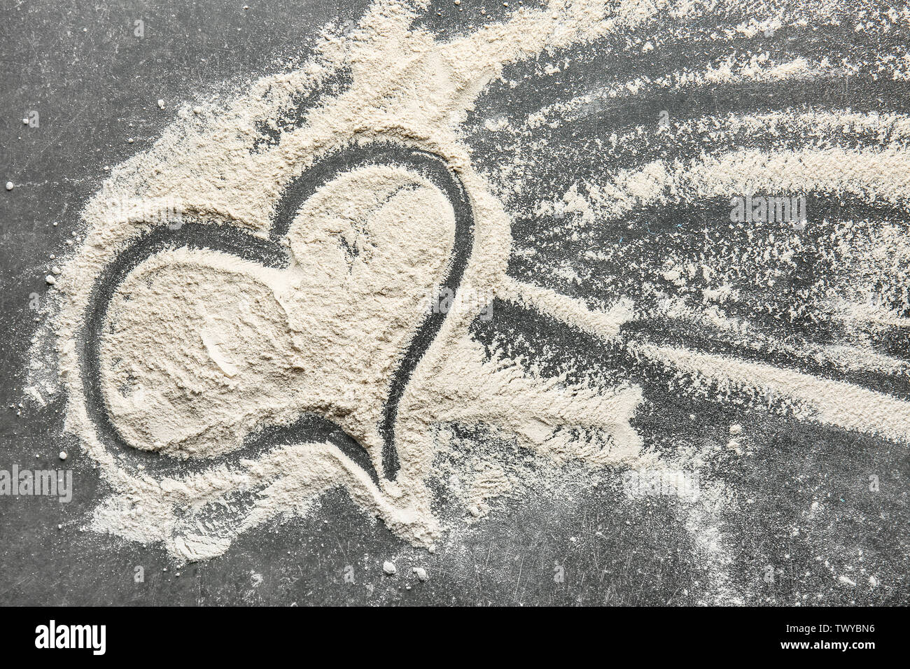 Heart shape drawn on flour Stock Photo - Alamy