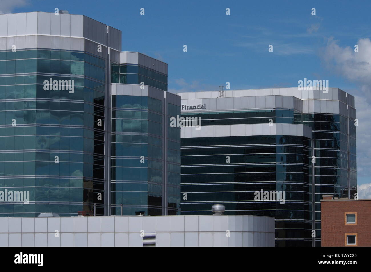 Glass tower office buildings against a blue sky. Preston Street, Ottawa ...