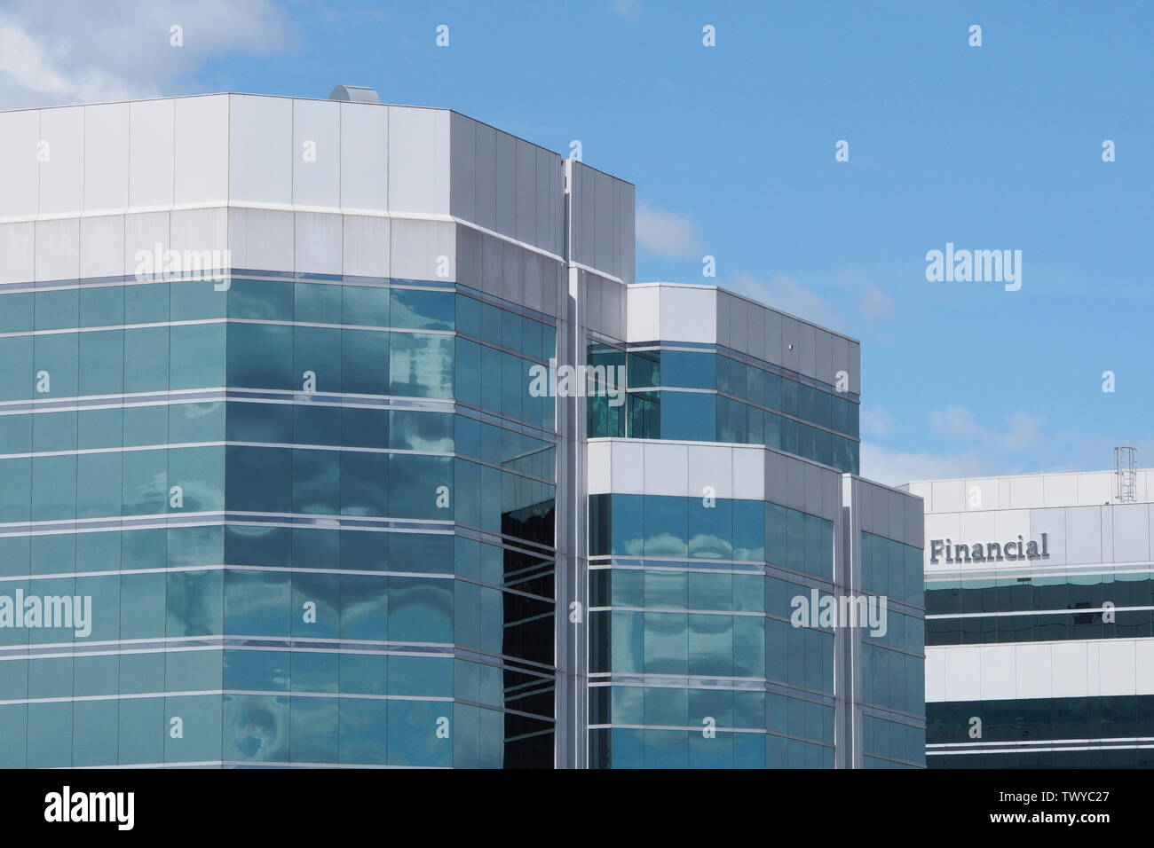 Glass tower office buildings against a blue sky. Preston Street, Ottawa ...