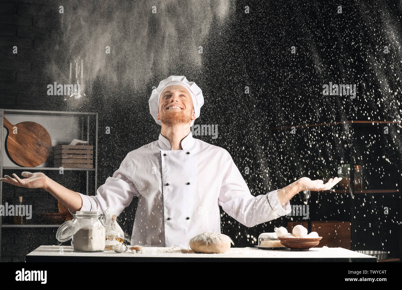 Male chef making dough in kitchen Stock Photo - Alamy