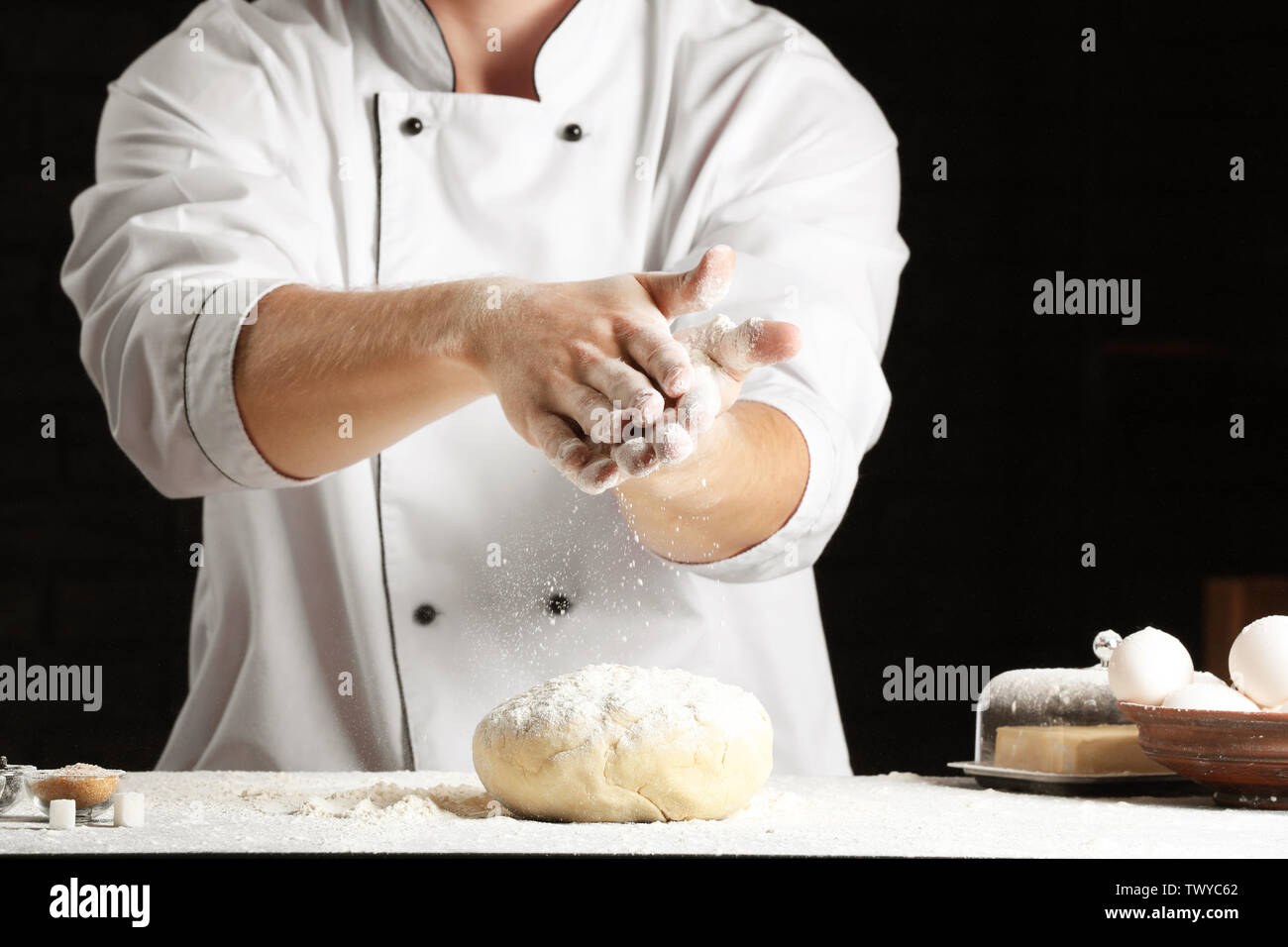 Male chef making dough in kitchen Stock Photo - Alamy
