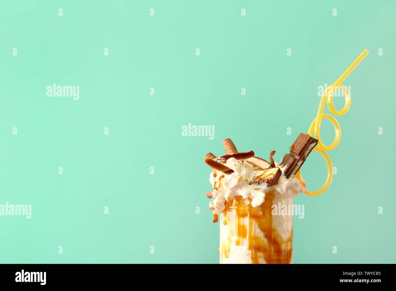 Delicious freak shake on color background Stock Photo - Alamy