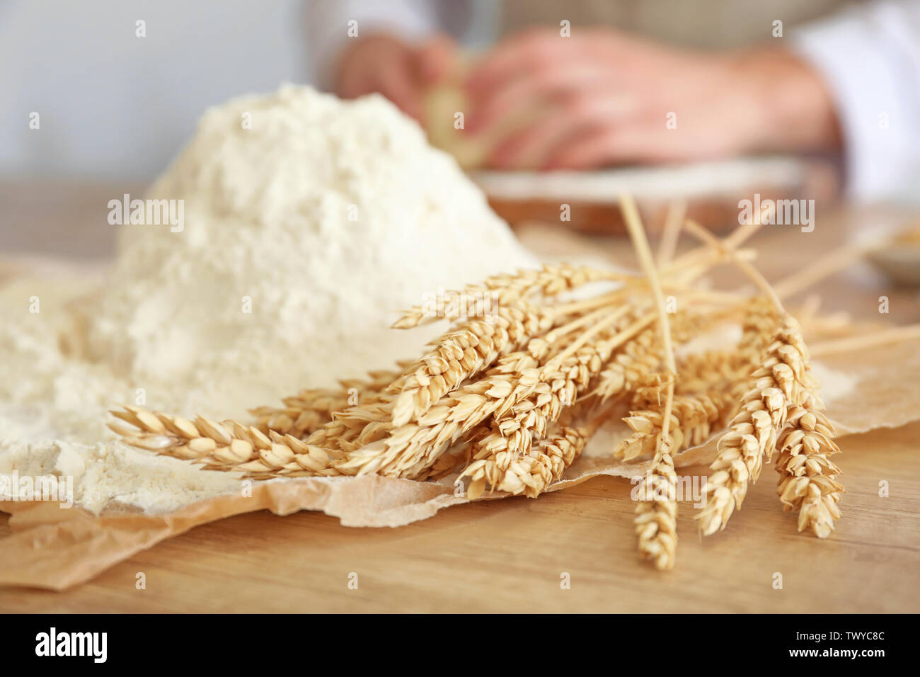 Wheat flour on table in kitchen Stock Photo - Alamy