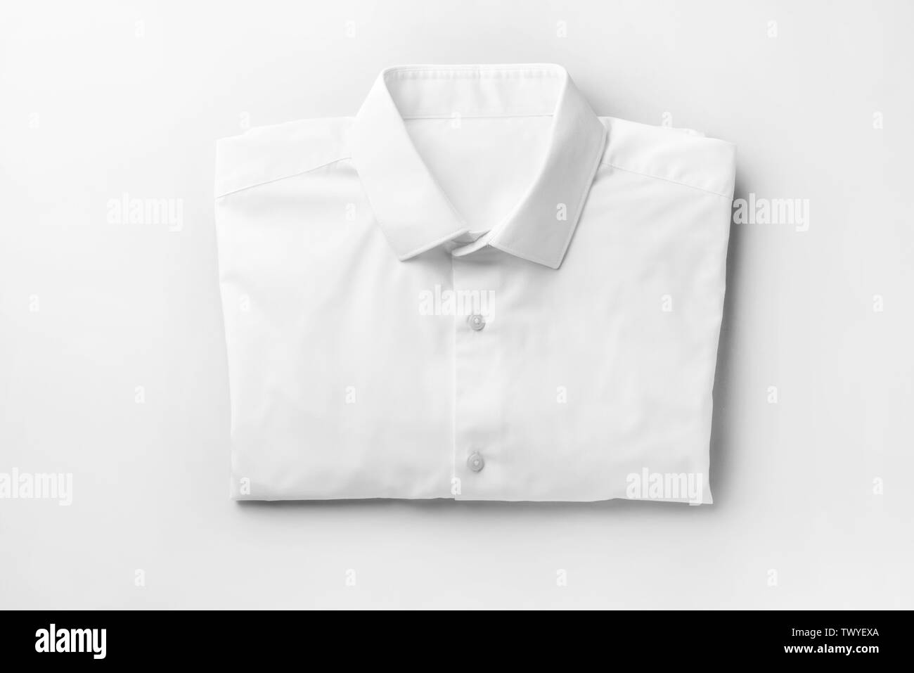 Shirt after dry-cleaning on light background Stock Photo - Alamy