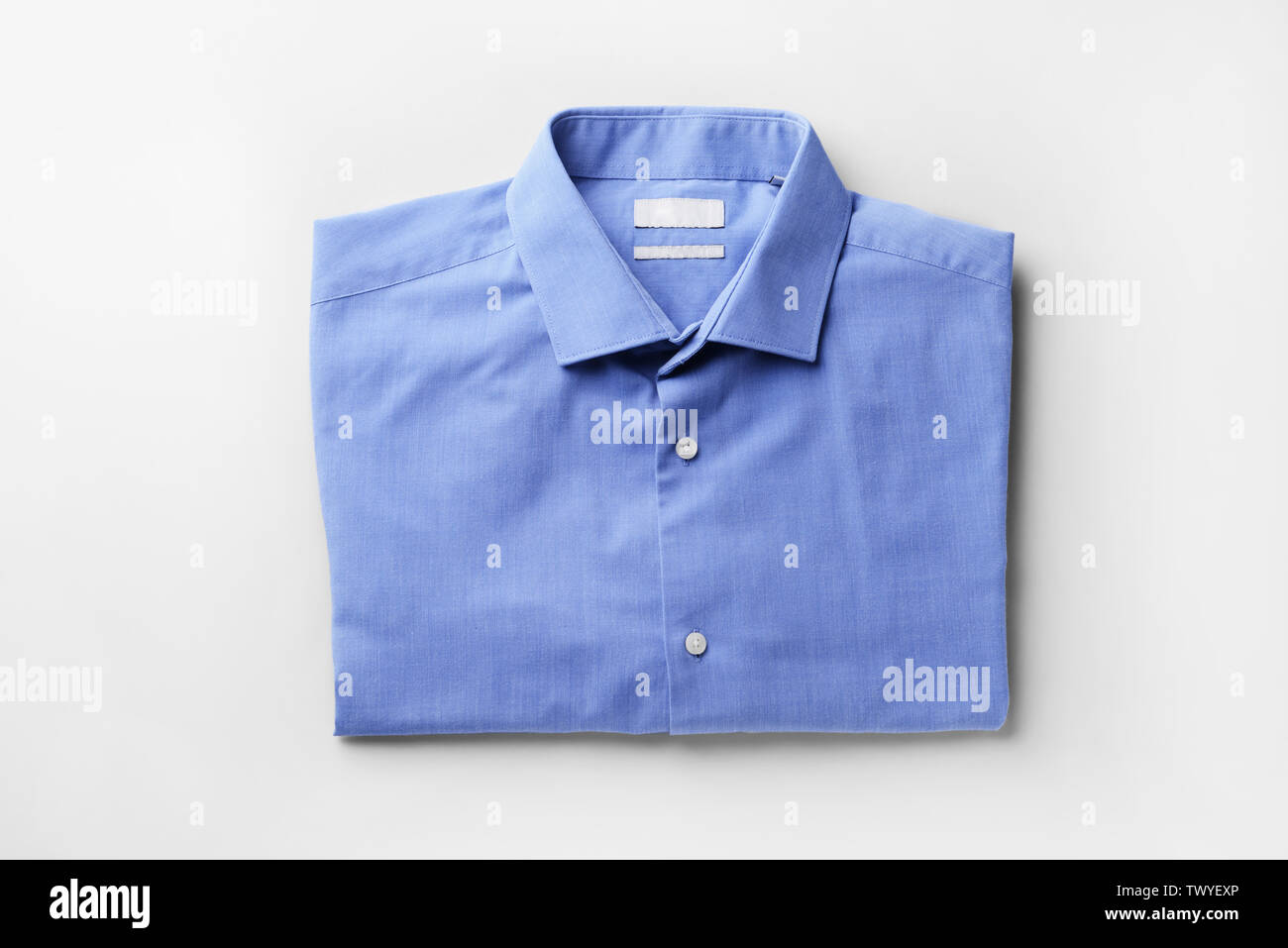 Shirt after dry-cleaning on light background Stock Photo - Alamy