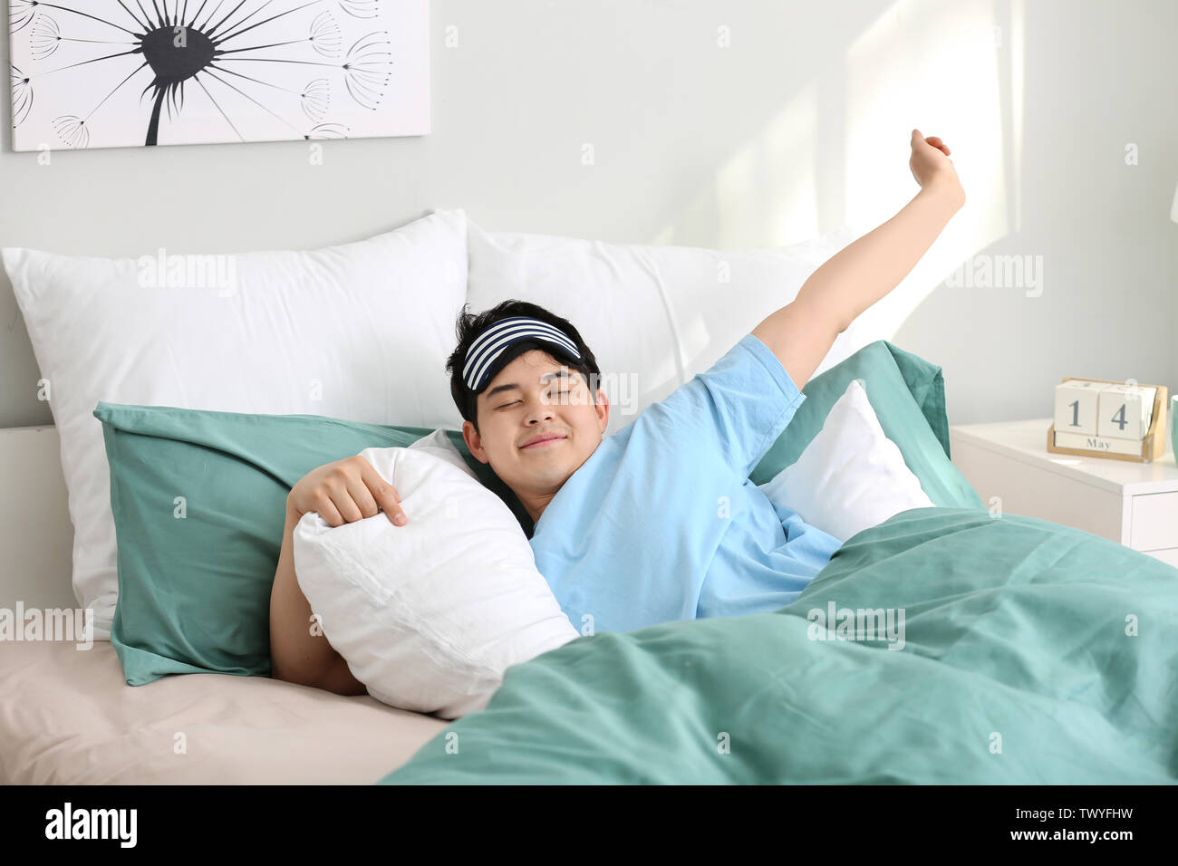 Morning of handsome young man in bed Stock Photo - Alamy