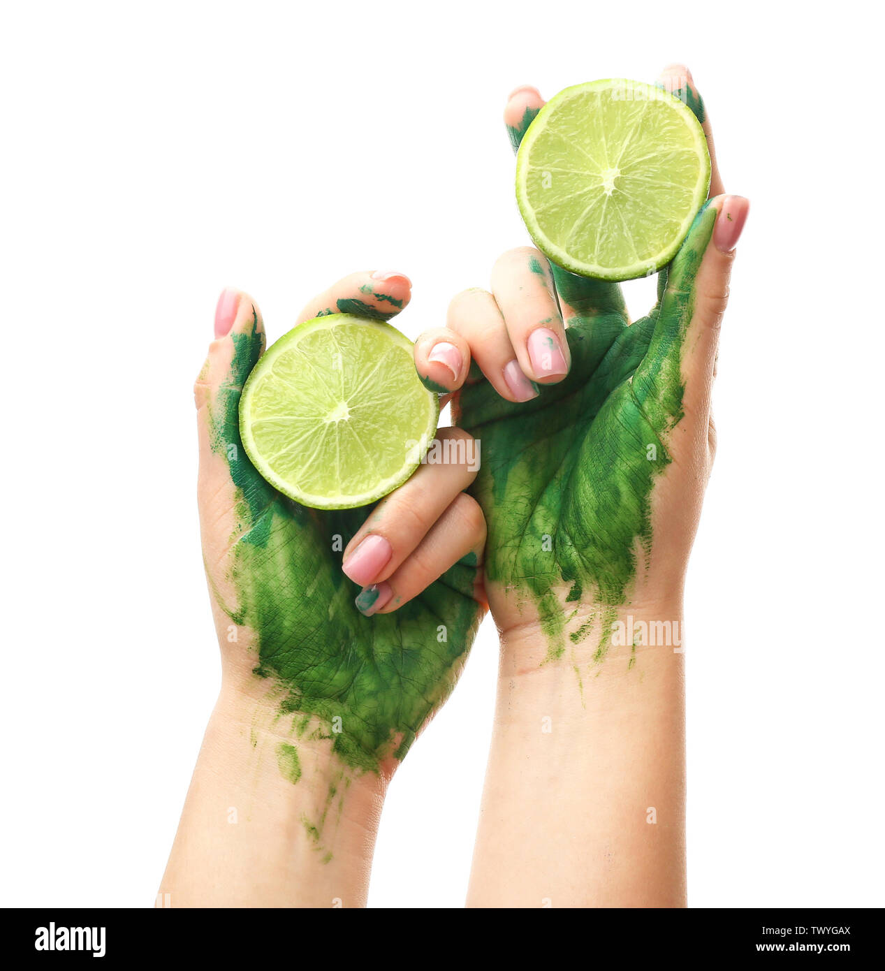 Painted female hands with lime on white background Stock Photo - Alamy