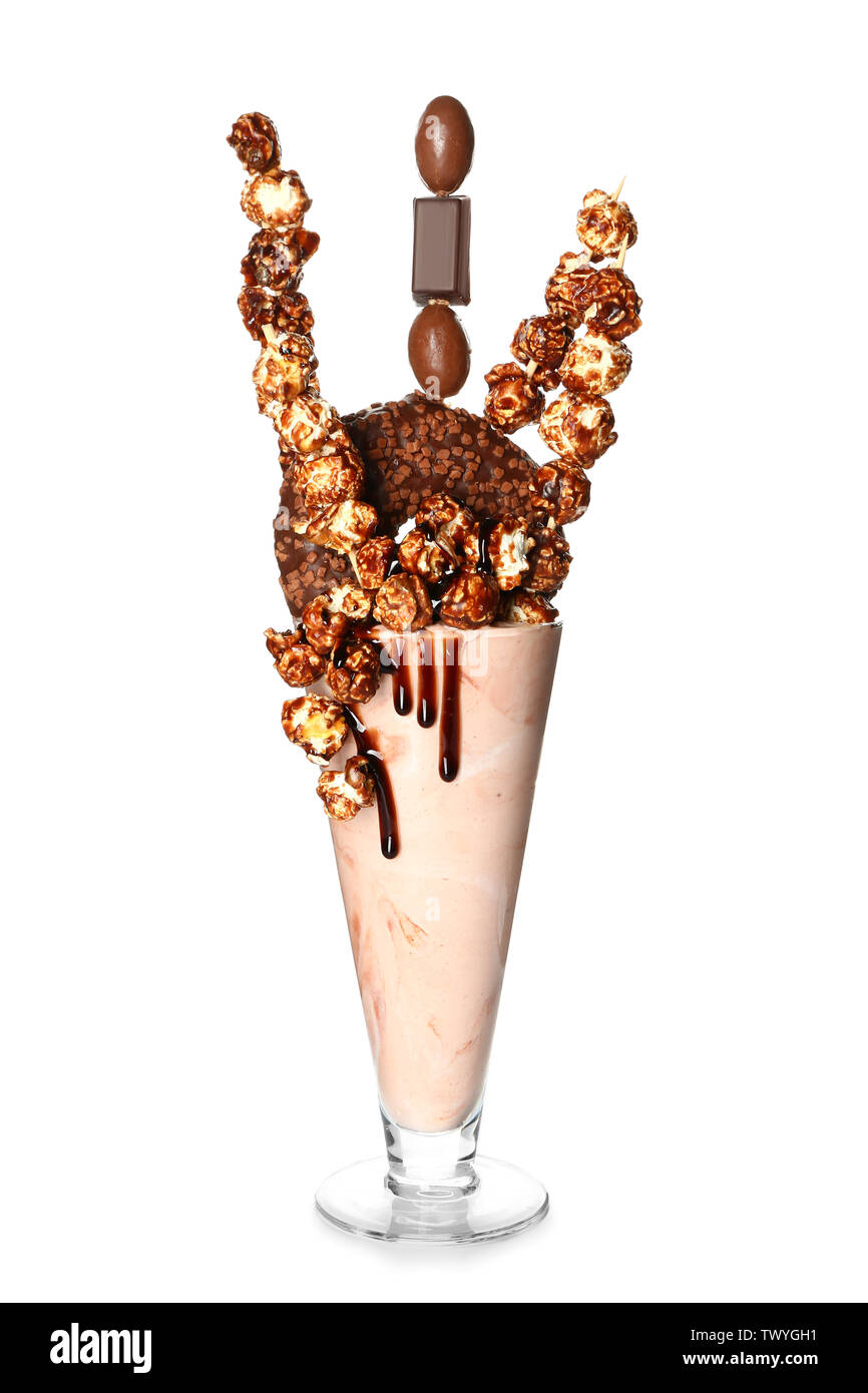 Glass with delicious freak shake on white background Stock Photo - Alamy