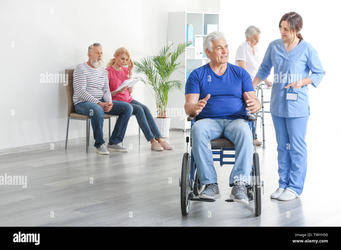Young man looking after elderly hi-res stock photography and images - Alamy