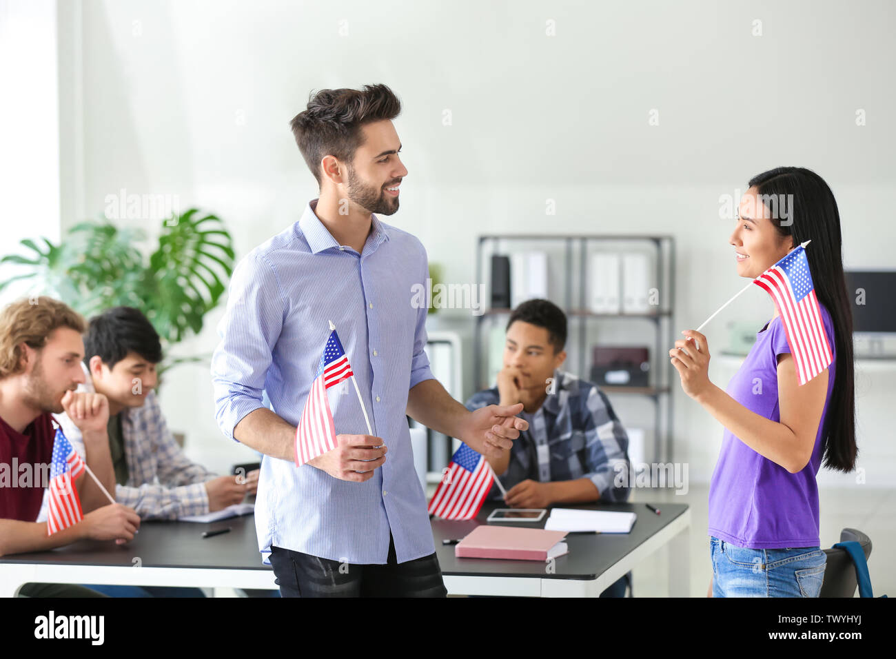 Students with USA flags in classroom Stock Photo - Alamy