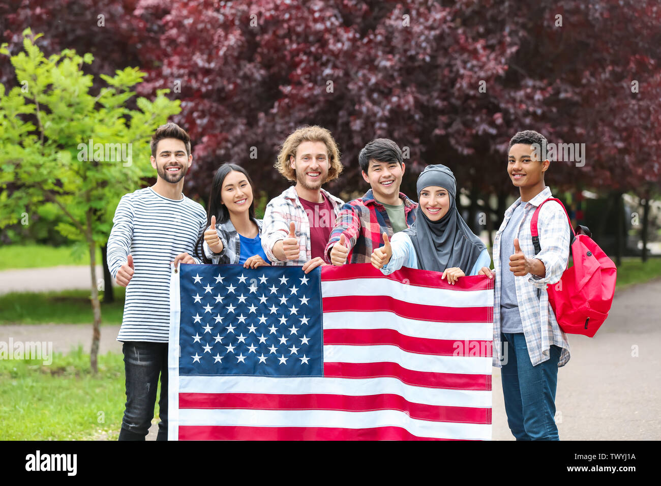 Group of students with USA flag outdoors Stock Photo - Alamy
